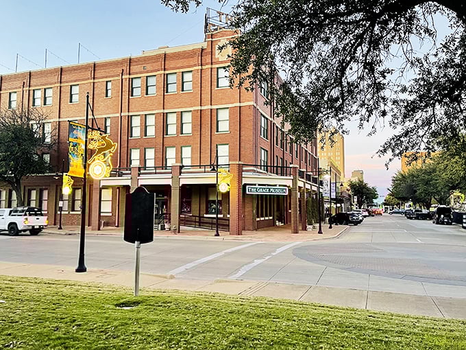 This historic hotel building in downtown Abilene now welcomes visitors as a beautifully restored landmark against the evening sky.