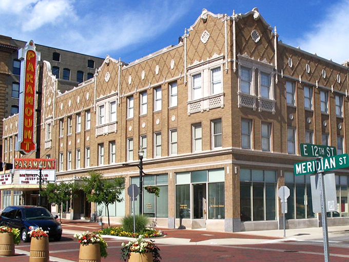 The Paramount Theatre marquee lights up downtown like it's announcing the biggest bargain in Indiana. Spoiler alert: it might be the town itself.