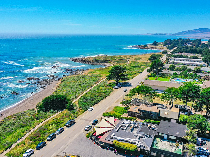 Colorful storefronts line Cambria's main drag, where coastal cool meets small-town charm just steps from the Pacific.
