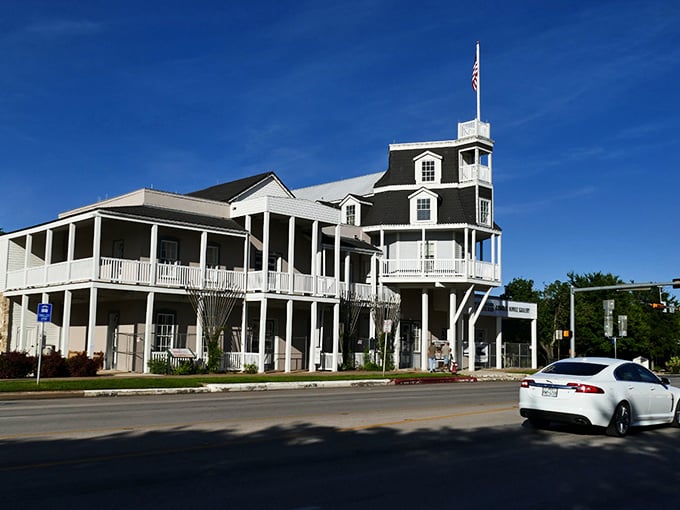 The town gazebo waits patiently for the next concert, like a white-painted conductor ready to orchestrate community joy.