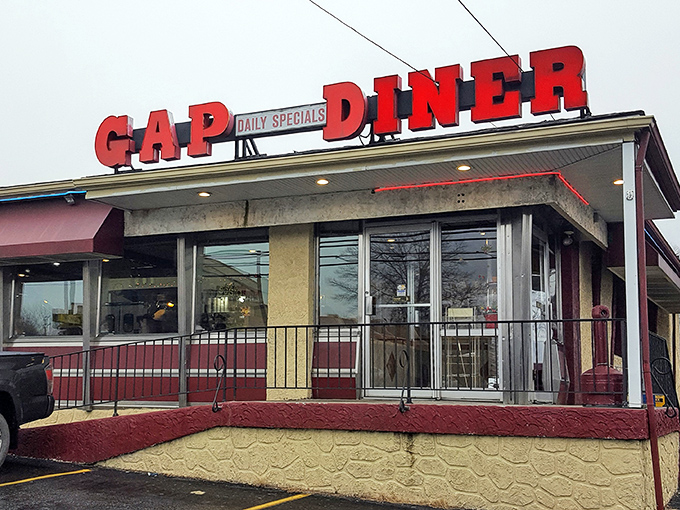 The GAP DINER sign glows like a neon promise that your wallet and stomach will both smile.