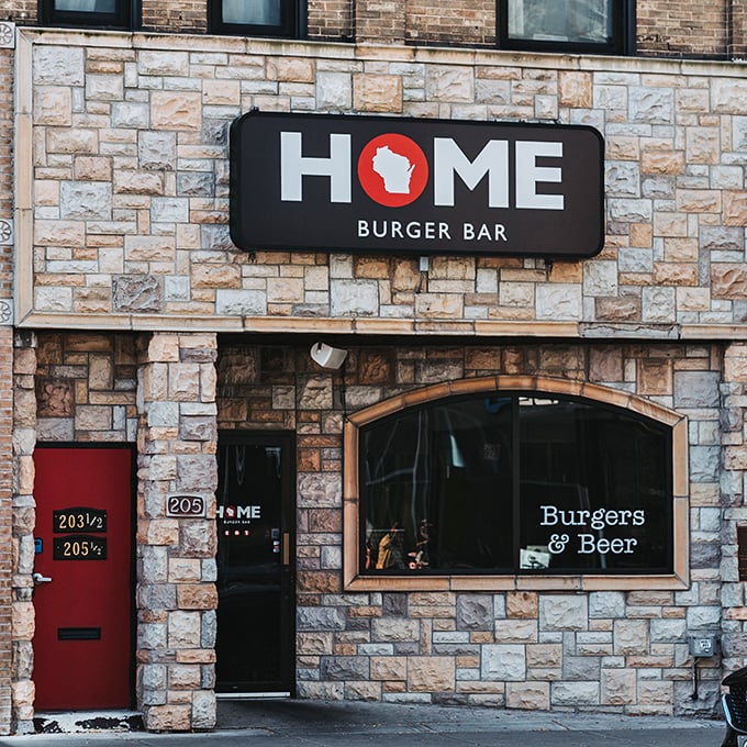Stone walls and a bright red door &ndash; Home Burger Bar looks like the cozy cottage where gourmet burgers were born.