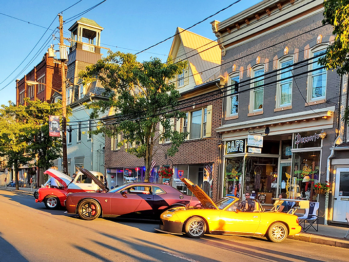 Classic car heaven! Huntingdon's sunset transforms ordinary storefronts into a golden backdrop for Detroit's finest moments in automotive history.