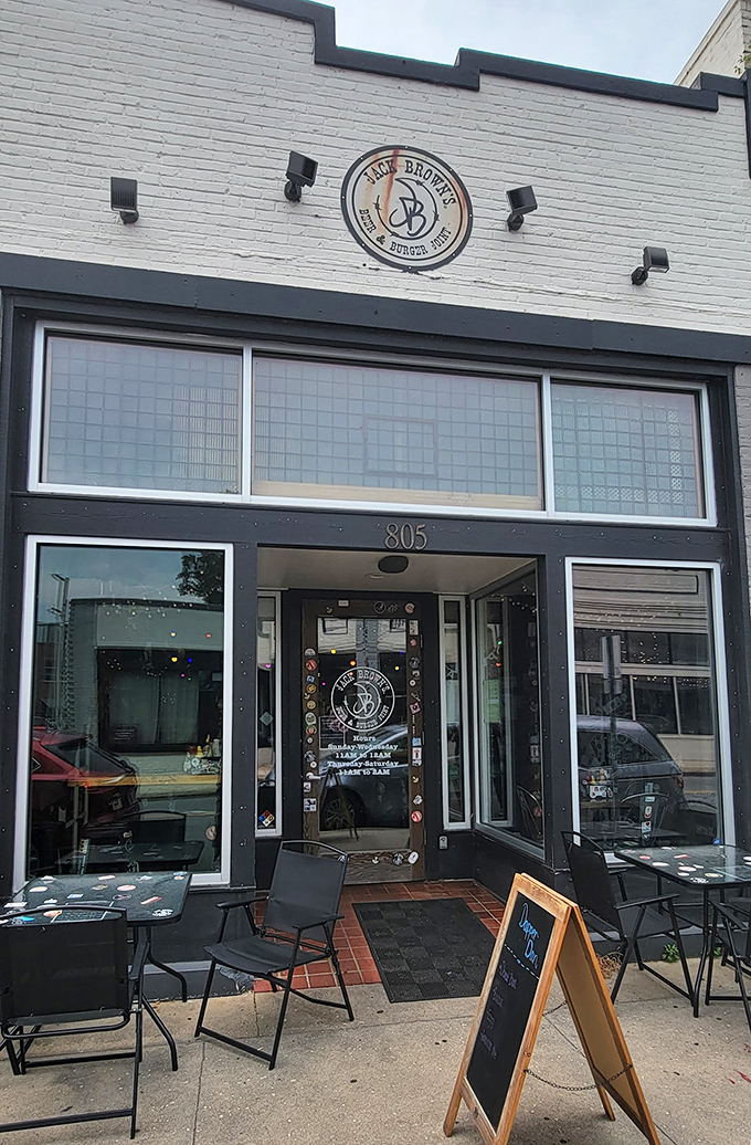 The welcoming entrance to Jack Brown's, where sticker-adorned doors hint at the quirky personality inside.