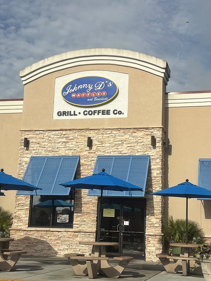 The outdoor tables at Johnny D's offer the perfect spot to contemplate life's big question: sweet waffles or savory benedicts?