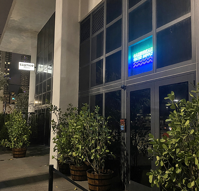 Those potted plants aren't just decoration&mdash;they're your first clue that behind these doors lies a hidden tropical paradise.