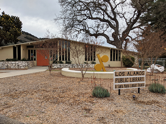 Mid-century meets literary magic at Los Alamos Library. That tree stands guard like a wise old storyteller &ndash; probably seen more plot twists than a Hitchcock marathon!