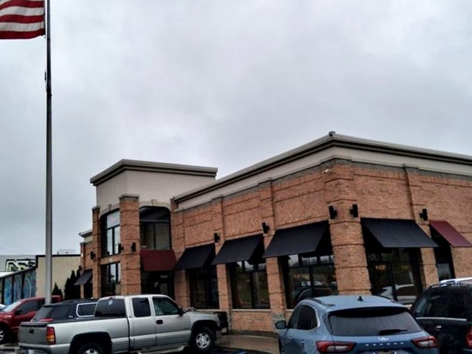 The bright entrance to Louie's Ham & Corned Beef stands out like a breakfast beacon in Detroit's morning landscape.