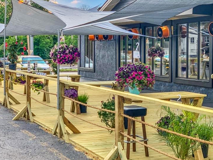 The outdoor seating at MadMacs blooms with color and comfort – the perfect backdrop for burger bliss.