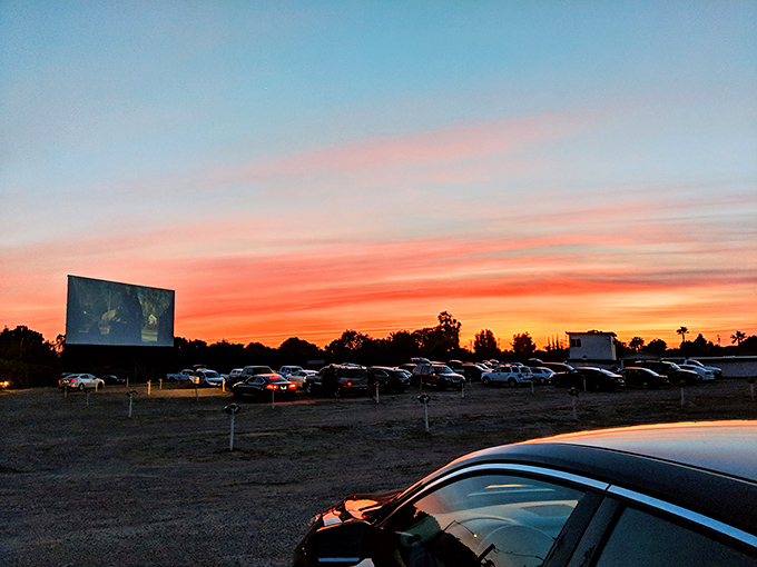 Blue skies fade to showtime at Madera 2. The massive screen awaits its transformation from blank canvas to cinematic magic.