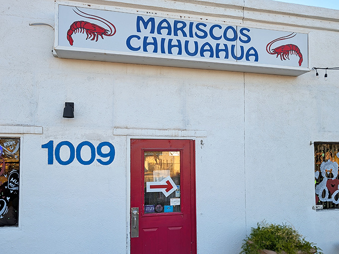The bright red door at Mariscos Chihuahua is like a portal to coastal Mexico. One step inside and your taste buds are on vacation.