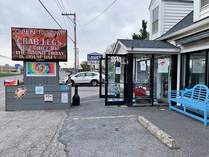 May's Restaurant doesn't need fancy signage when their crab cakes speak volumes. That blue bench has heard many satisfied sighs.