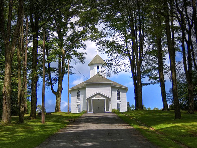 A quiet path leads to this peaceful white church, tucked among the trees and full of Mount Jewett&rsquo;s timeless countryside charm.