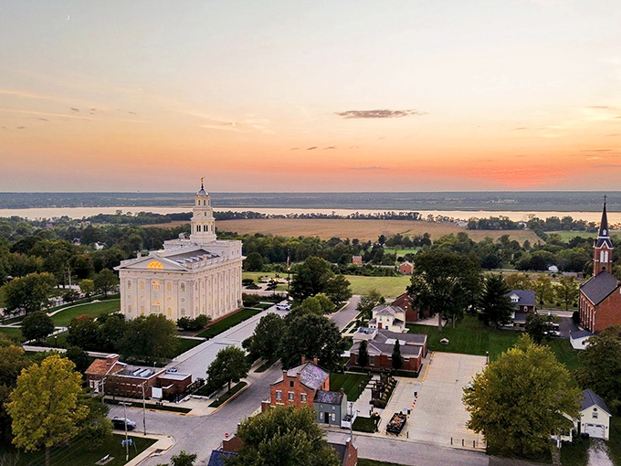 Nauvoo's stunning temple dominates the skyline, a gleaming testament to faith and craftsmanship overlooking the Mississippi River.