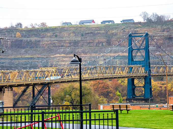 From this vantage point, the mighty Ohio River flows like a blue highway, carrying barges and centuries of American history.