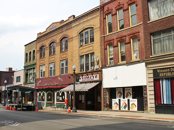 Historic downtown Oil City features classic brick buildings and local businesses along its main street, reflecting the city's industrial heritage.
