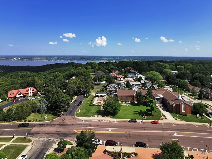 That church spire reaches toward heaven while downtown Peoria keeps both feet firmly planted in Midwest practicality.
