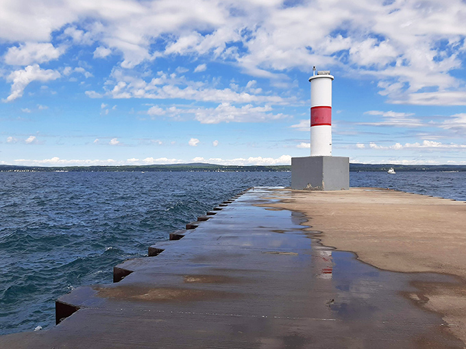 Petoskey’s iconic lighthouse stands tall against the backdrop of Lake Michigan—a picture-perfect scene of Pure Michigan charm.