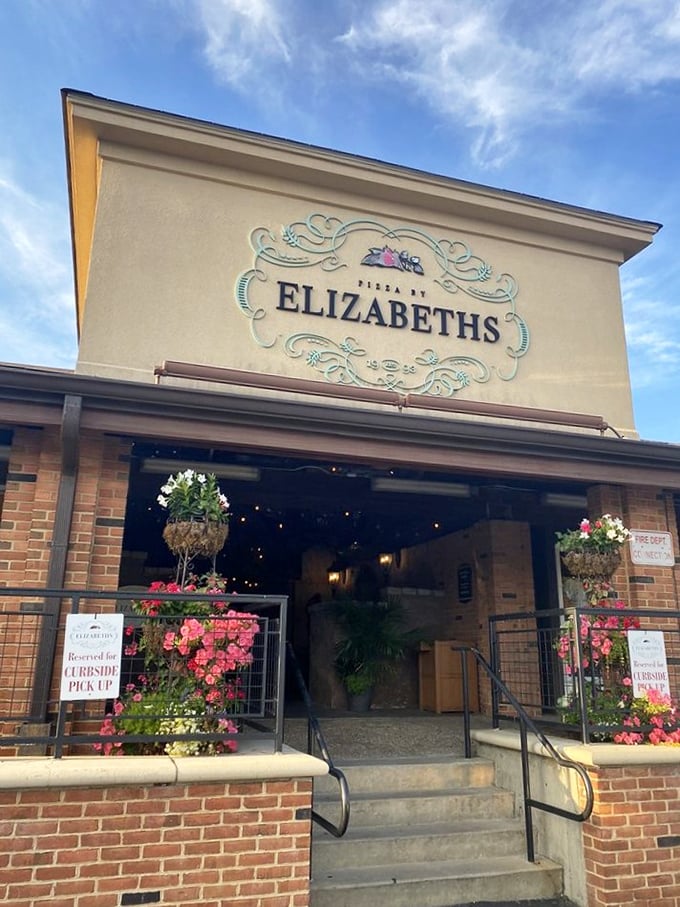 Hanging flowers frame the entrance to pizza paradise. Elizabeth's knows first impressions matter almost as much as that first bite.