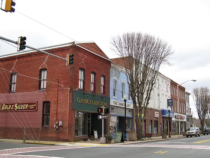 Classic American storefronts line the quiet streets where time moves at the pace of a gentle river.