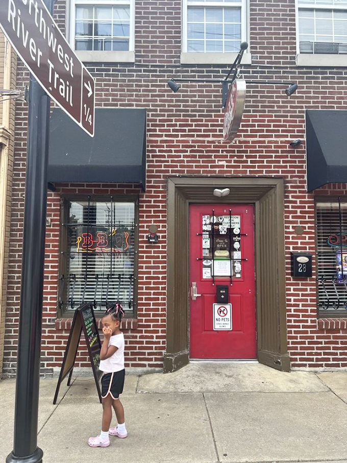 Rocky's red door beckons river trail wanderers with the universal language of smoke and spice.