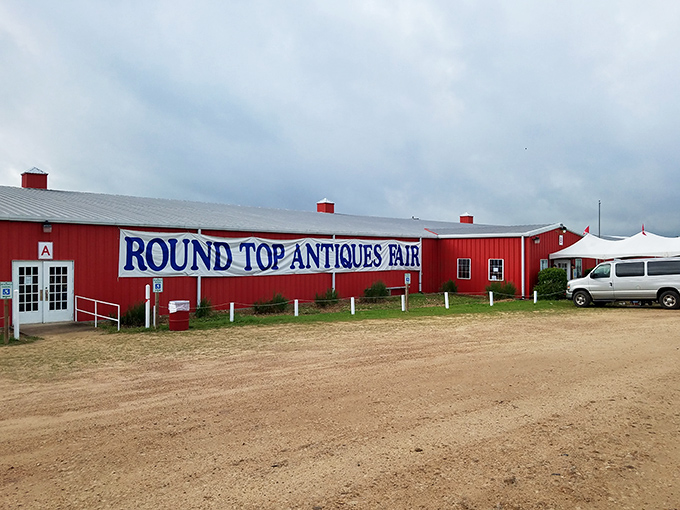 The iconic red barn of Round Top Antiques Fair welcomes treasure hunters from across the country. Even the clouds seem to pause overhead to admire the scene!