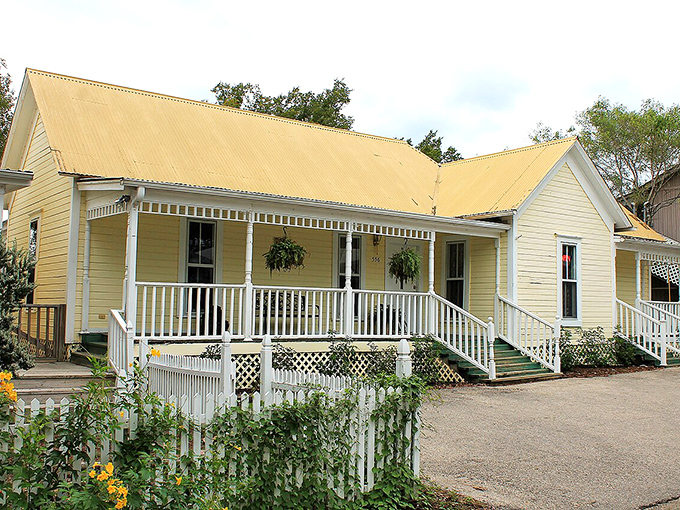 This charming yellow cottage with its welcoming porch practically whispers, "Come sit a spell" in the most delightful Texas accent.