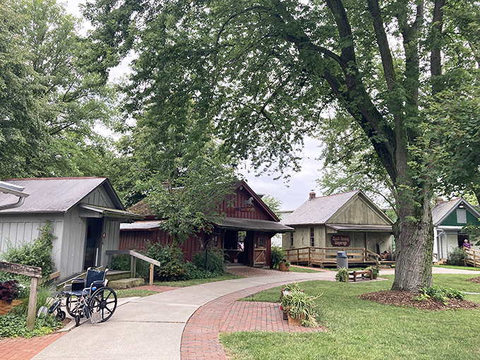 A winding brick path leads visitors through Sauder Village—where history isn't just displayed behind glass, it's alive and kicking!