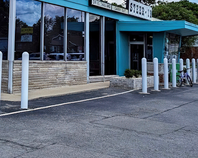 Steer-In: White posts standing guard like sentinels protecting the sacred breakfast traditions within. The blue says "trust me."