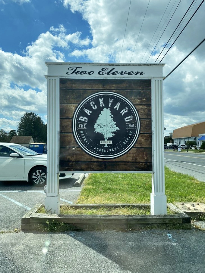 The classic "Two Eleven" sign marks the spot where Milton's burger magic happens daily. 