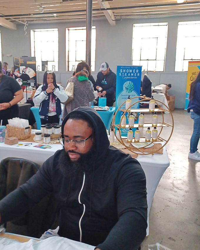 Vendors at The Black Mall create a warm, community atmosphere where every purchase feels like supporting a neighbor's dream.