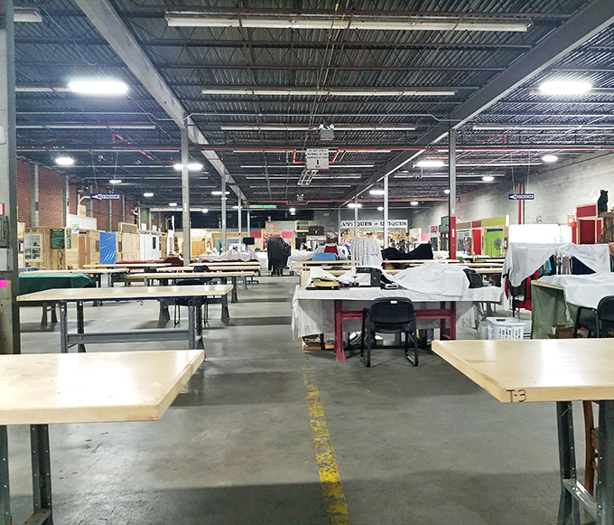 Empty tables waiting for weekend vendors like a blank canvas. Tomorrow, this space becomes a bustling bazaar of bargains.