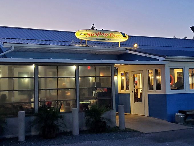 Evening lights twinkle at The Surfing Crab, where the only thing more satisfying than cracking shells is the sunset view.