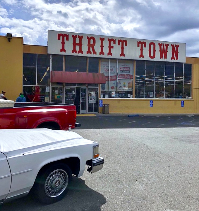 Under those cloudy skies, Thrift Town's yellow building stands like a lighthouse for the budget-conscious. Treasures await within!