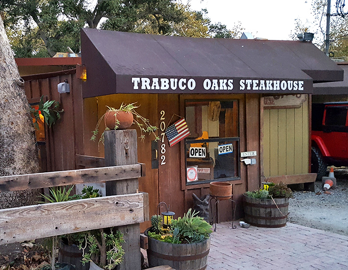 Those barrel planters and weathered wood promise the kind of authentic experience you can't fake.