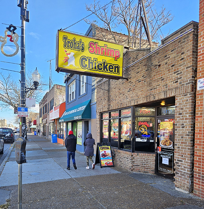 Behind those neon-lit windows, magic happens in the fryers at Troha's—crispy outside, tender inside, happiness all around.