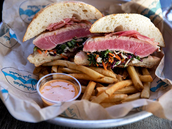 Seared ahi tuna that's still blushing in the middle, nestled in a sandwich that's both a work of art and a testament to simplicity.