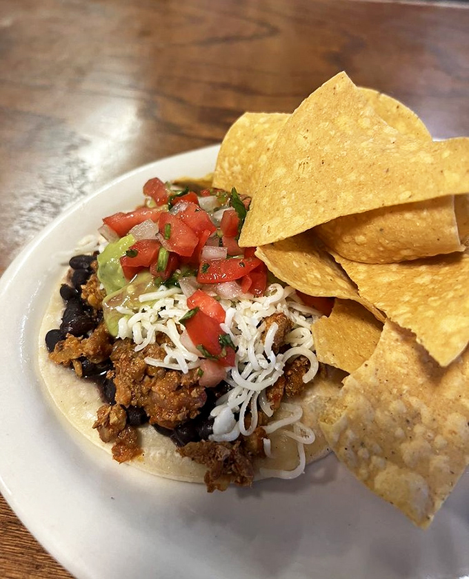 A perfect taco is poetry on a plate. This al pastor masterpiece with its crown of pico de gallo deserves its own sonnet.
