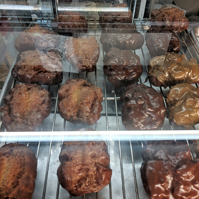 These apple fritters aren't just donuts&mdash;they're architectural marvels of caramelized crust and tender interior that could make a pastry chef weep.