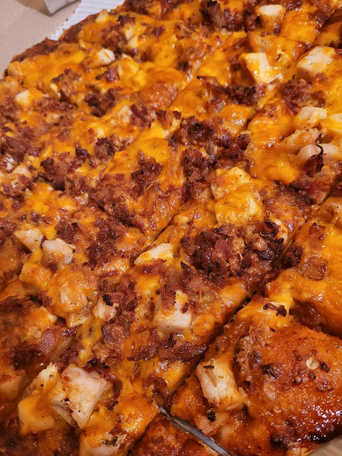 BBQ chicken pizza that doesn't hold back—chunks of chicken nestled in melted cheese with that perfect sweet-savory balance that makes you forget other pizzas exist.