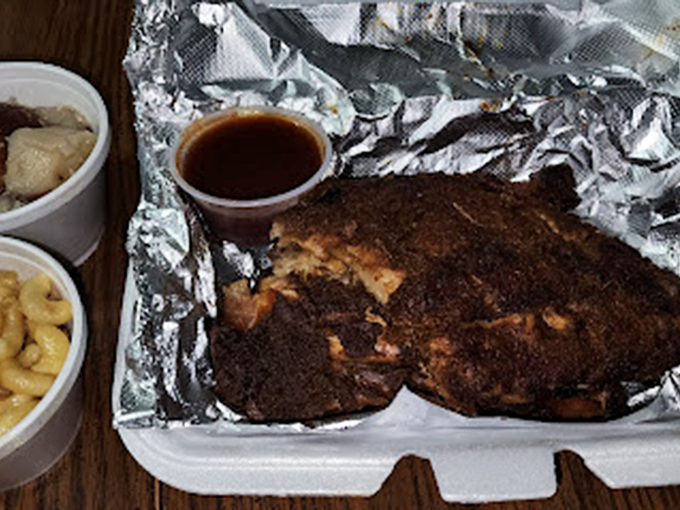 Behold the bark on that chicken! Paired with mac and cheese that's clearly been invited to the smokehouse party.