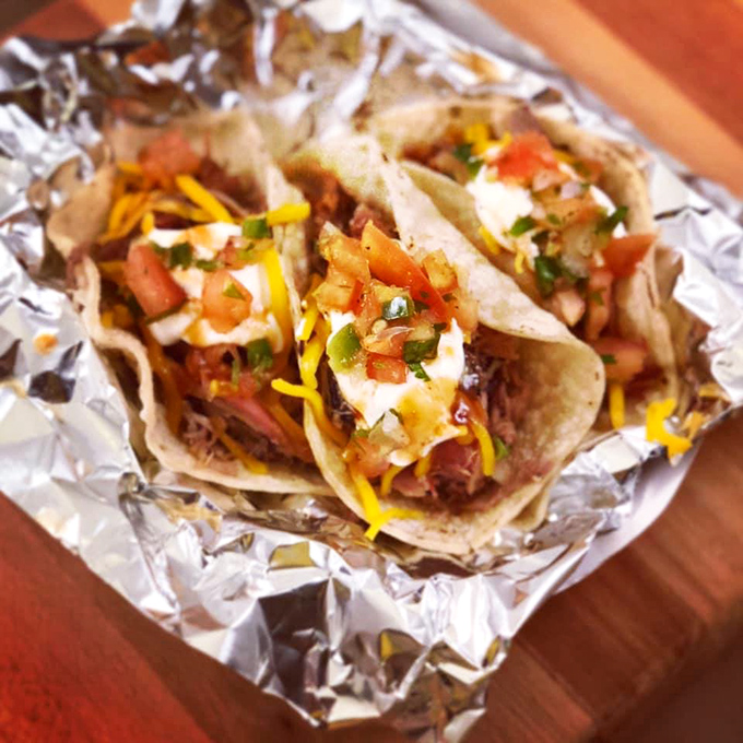 These aren't just tacos; they're barbecue's vacation home&mdash;smoked meat living its best life wrapped in tortillas with all the fixings.