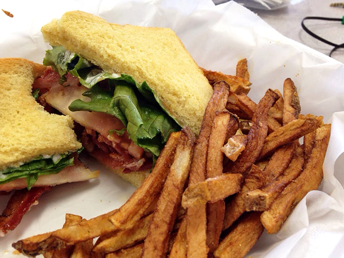 This isn't just a sandwich; it's architecture—layers of crisp lettuce, bacon, and tomato creating the kind of BLT that makes you wonder why you ever eat anything else.