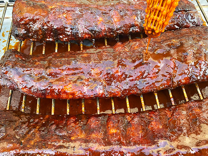 These ribs aren't just glazed&mdash;they're lacquered with barbecue perfection. The brush stroke of sauce is basically edible calligraphy.