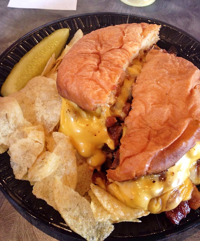 This isn't just a burger&mdash;it's an architectural masterpiece of melted cheese cascading over bacon and beef on a perfectly toasted bun. Napkins required, regrets impossible.