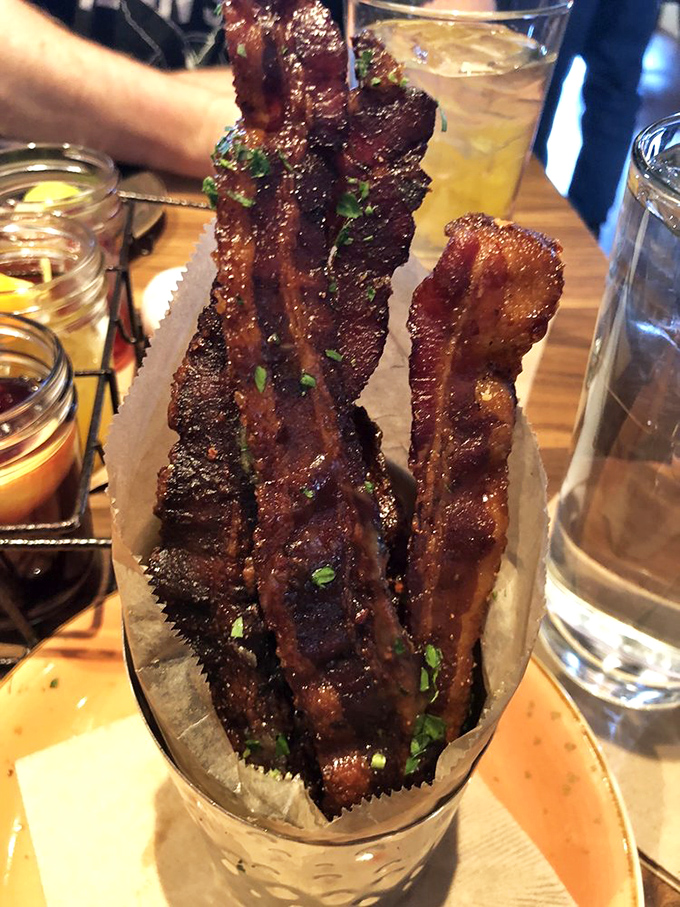 Bacon elevated to art form. These caramelized strips aren't just breakfast sidekicks&mdash;they're the main event, served with dipping sauces for good measure.