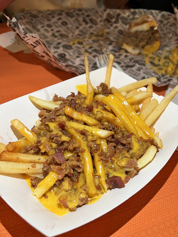 Cheese fries elevated to an art form&mdash;where molten cheese and seasoned meat transform humble potatoes into something transcendent.