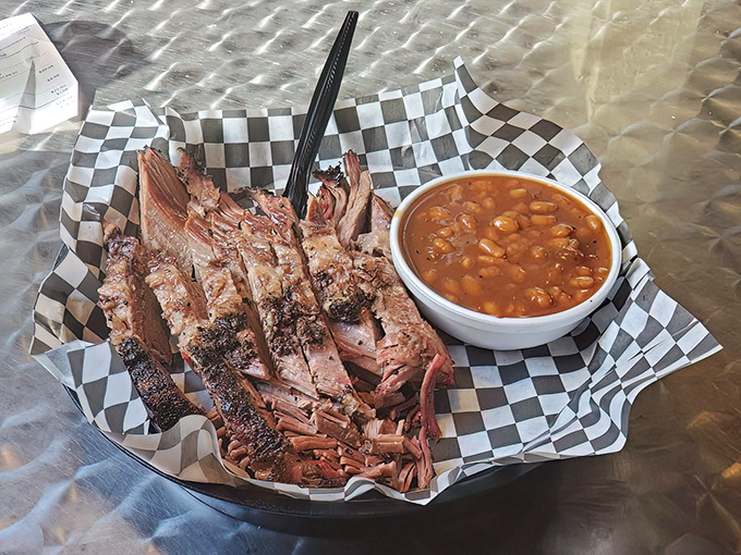 These baked beans have clearly been introduced to some brisket along the way. It's not just a side &ndash; it's a supporting character deserving an award.