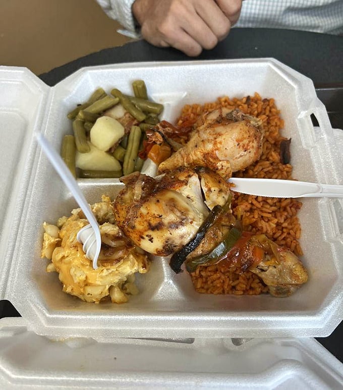 The holy trinity of Southern comfort: perfectly seasoned chicken, mac and cheese that could make a grown person weep, and red rice that demands to be savored.