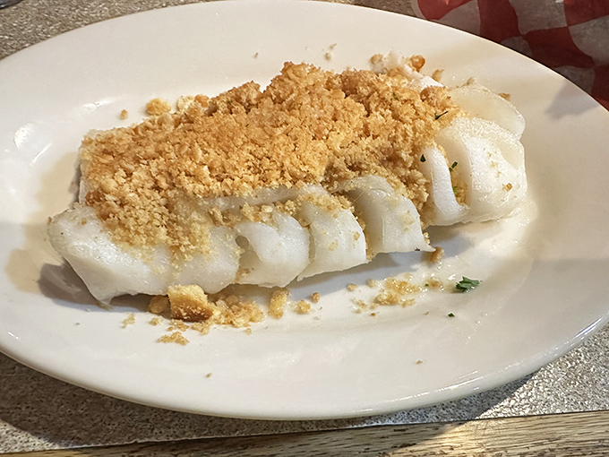 Baked haddock crowned with golden crumbs&mdash;like a fish that dressed up for the opera and accidentally stole the show.